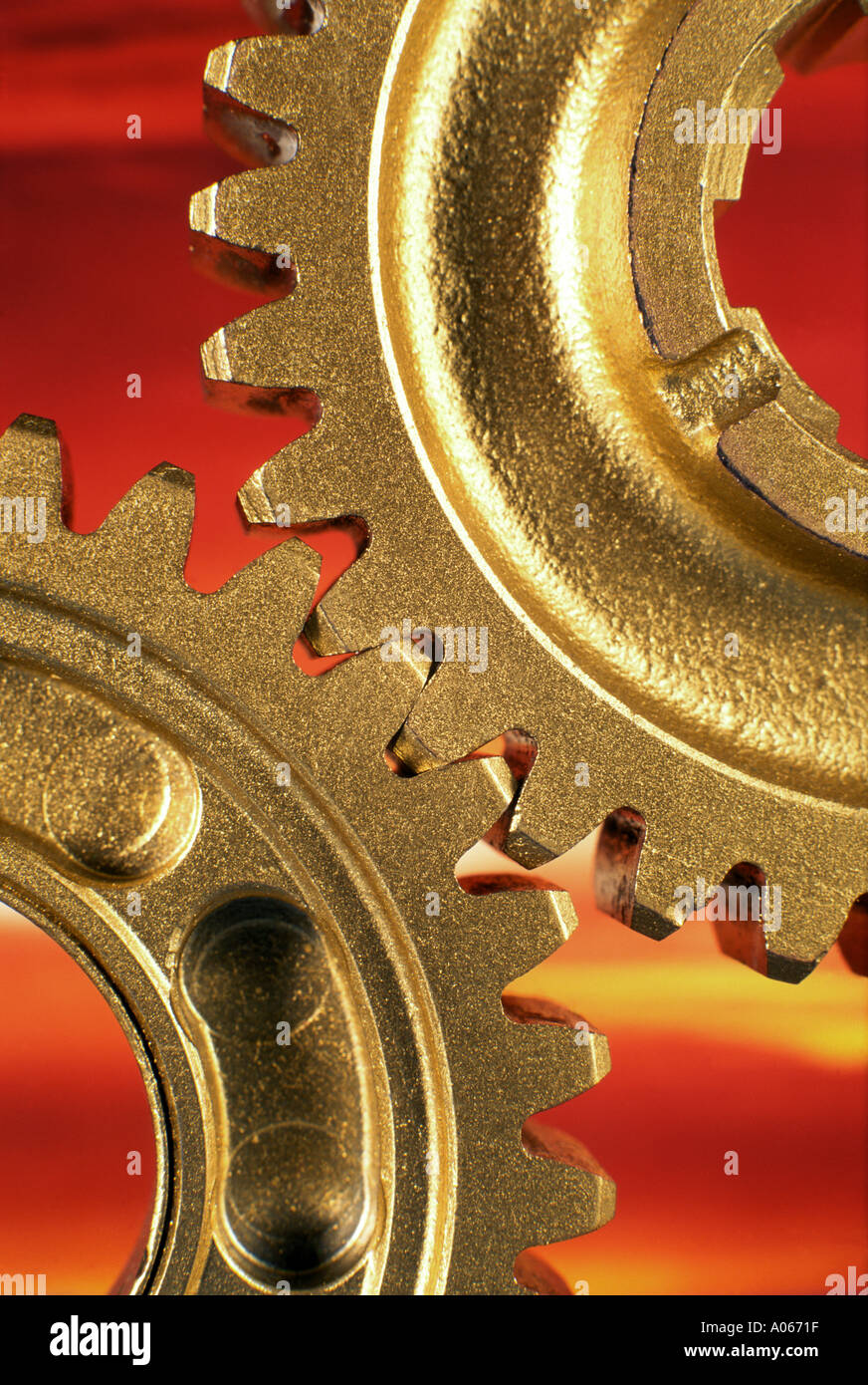 Gear wheels meshing together Stock Photo - Alamy