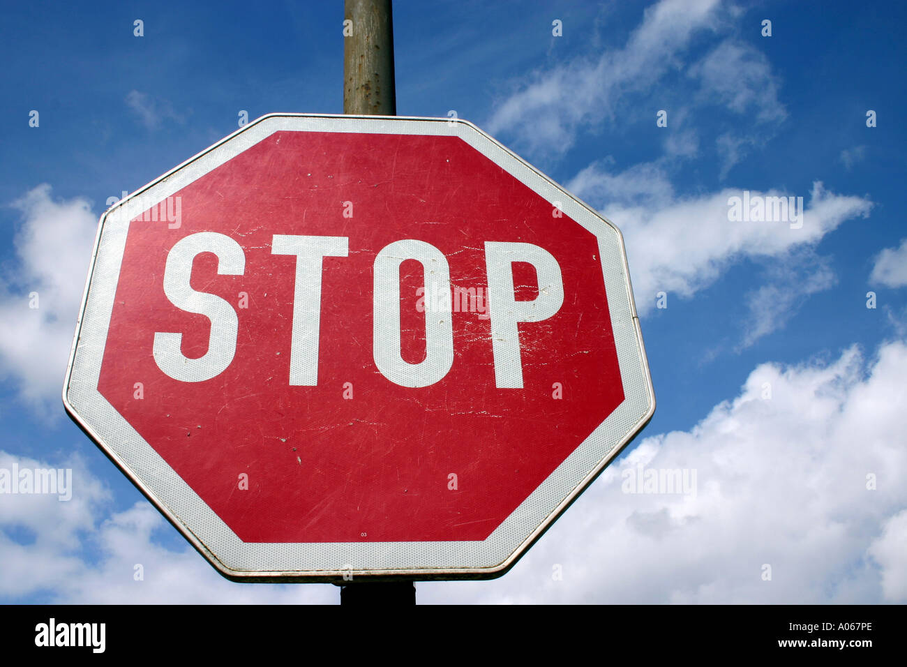 Board in an octagon shape with STOP written on it Stock Photo - Alamy