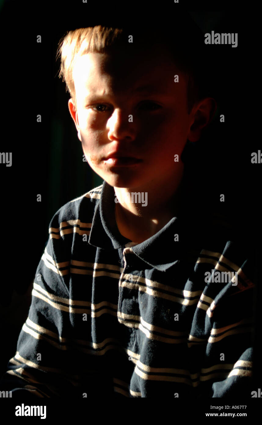 Serious boy hiding hi-res stock photography and images - Alamy