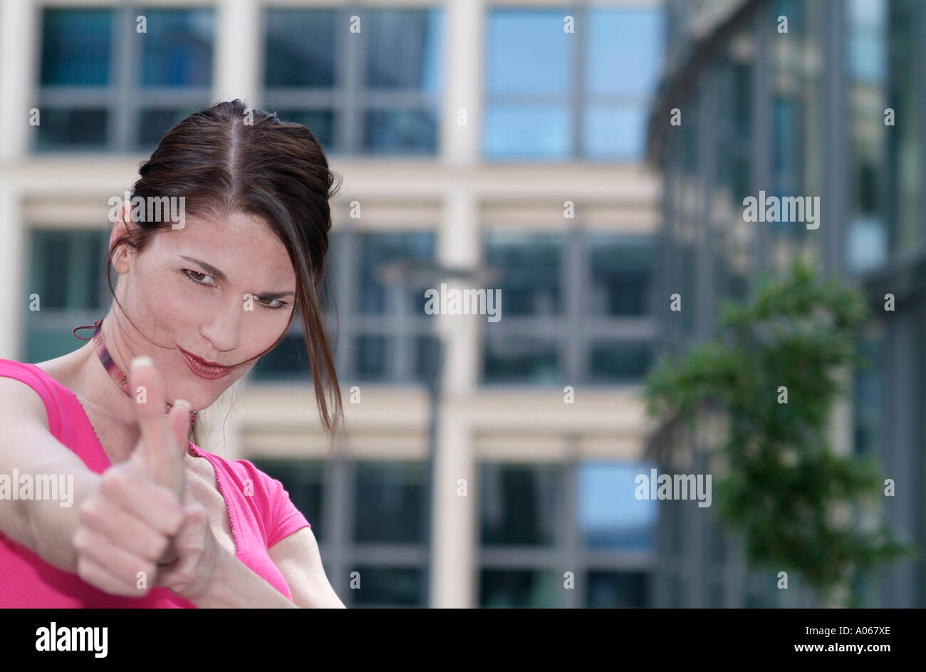 A smart woman is wishing luck as she looks at the camera Stock Photo ...