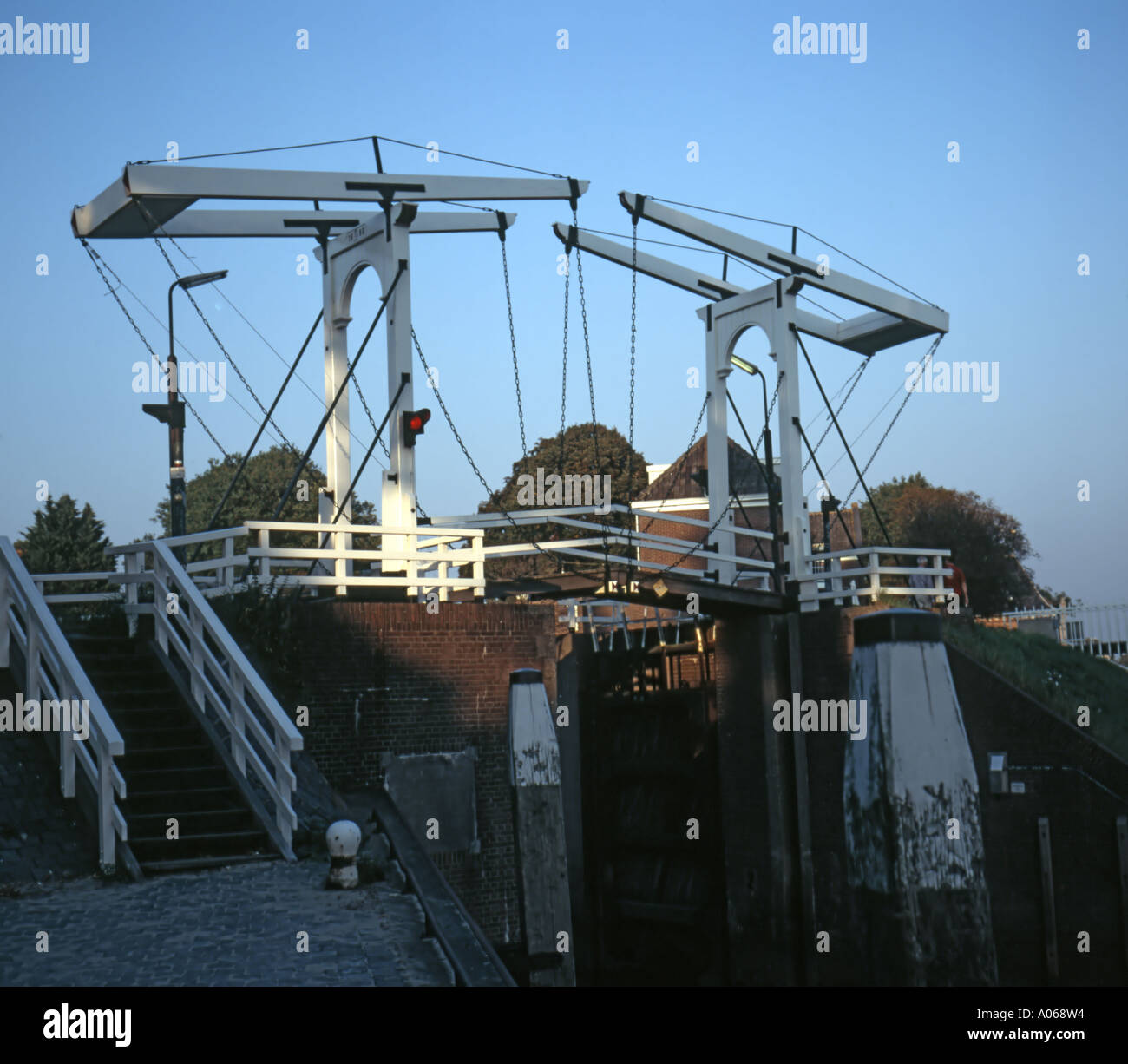 Typical Dutch bridge in the evening sun in Schoonhoven Stock Photo - Alamy