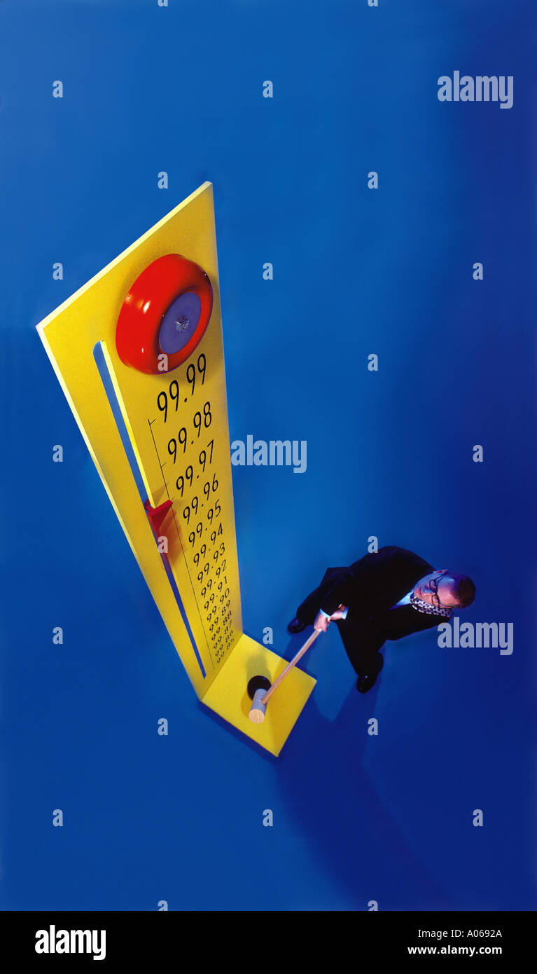 Businessman test strength machine hi-res stock photography and images ...