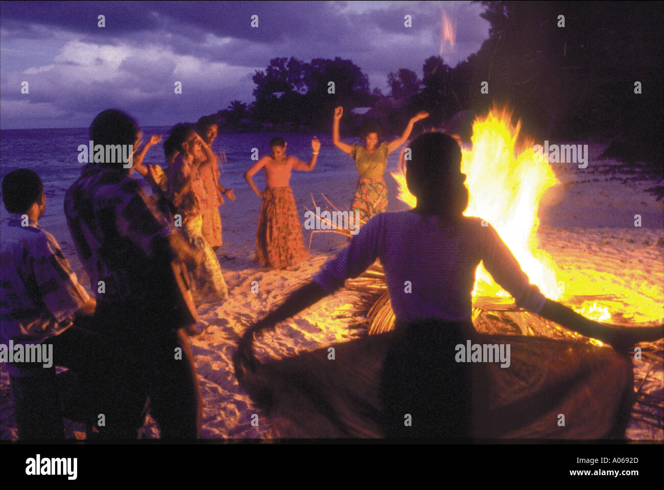 African People Dancing Around Fire