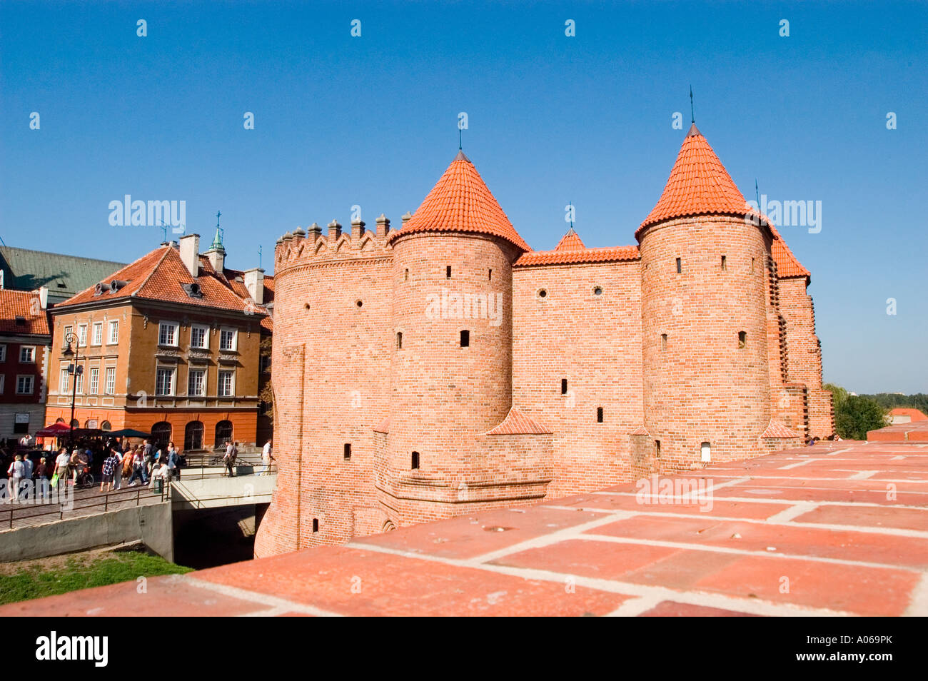 Barbican aka Barbakan medieval defence walls with towers and red tiles ...