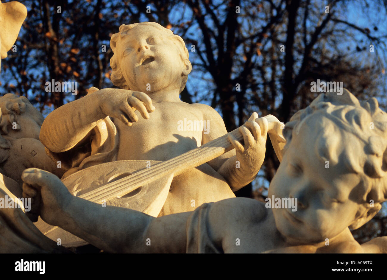 Detail of cherubs statues playing a musical instrument part of the ...