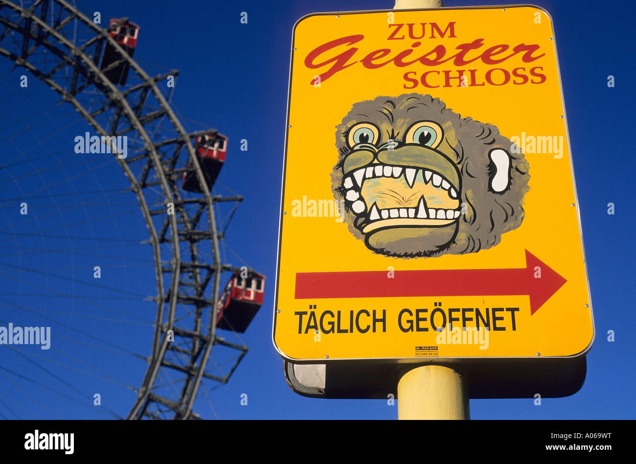 Ferris wheel behind the funfair sign in the Prater area of Vienna Stock ...
