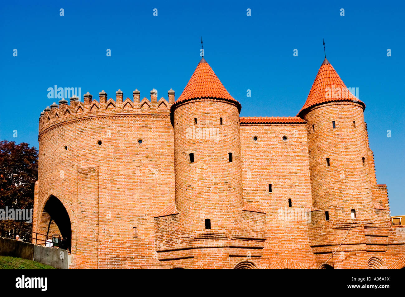 Barbican aka Barbakan medieval defence walls with towers and red tiles ...