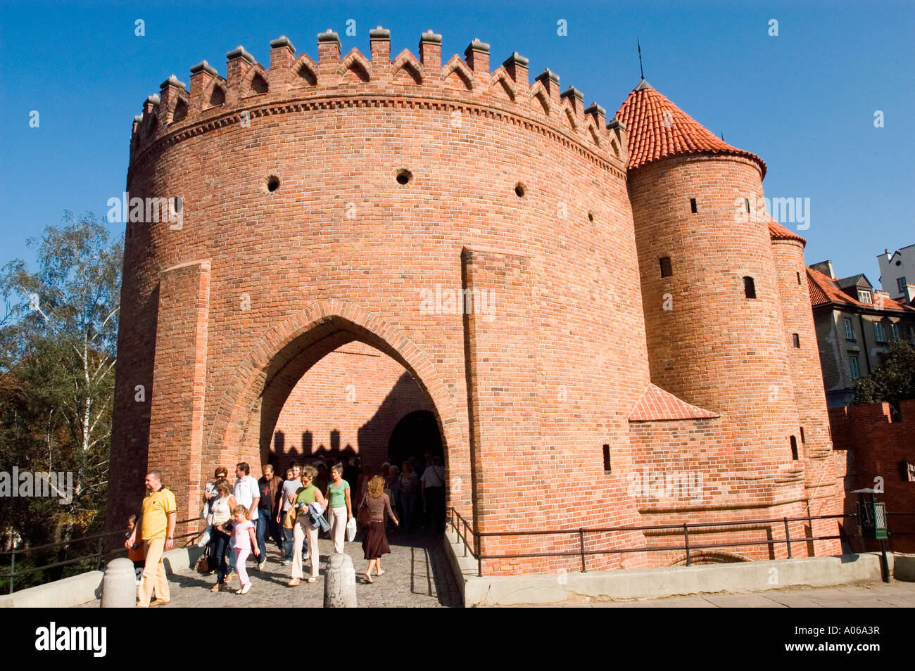Barbican aka Barbakan medieval defence walls with towers and red tiles ...