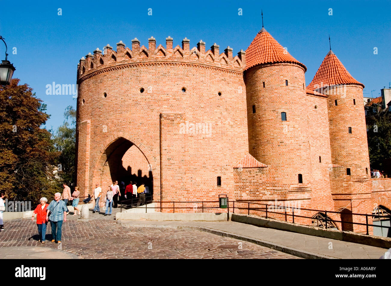 Barbican aka Barbakan medieval defence walls with towers and red tiles ...
