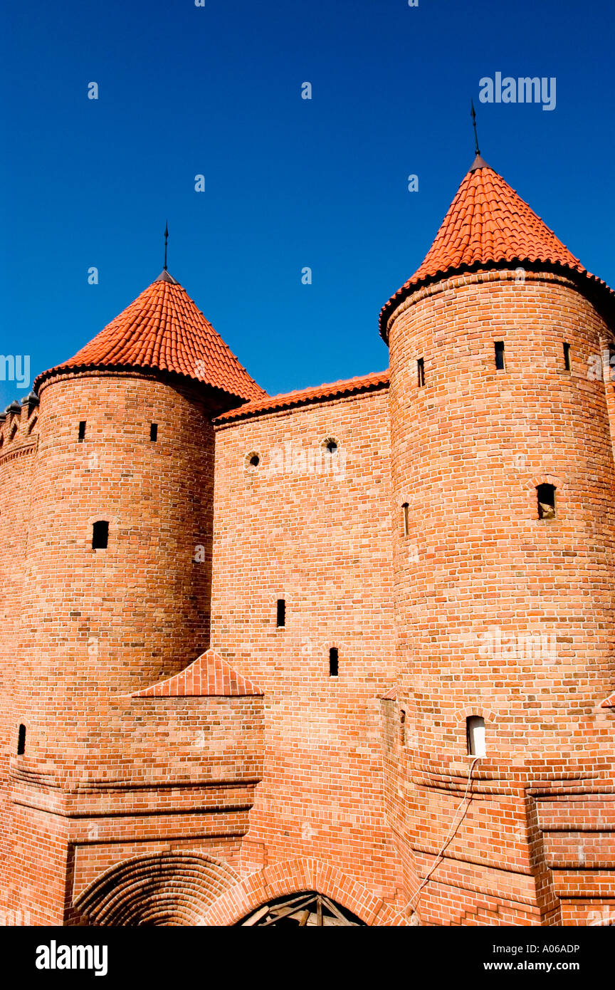Barbican aka Barbakan medieval defence walls with towers and red tiles ...