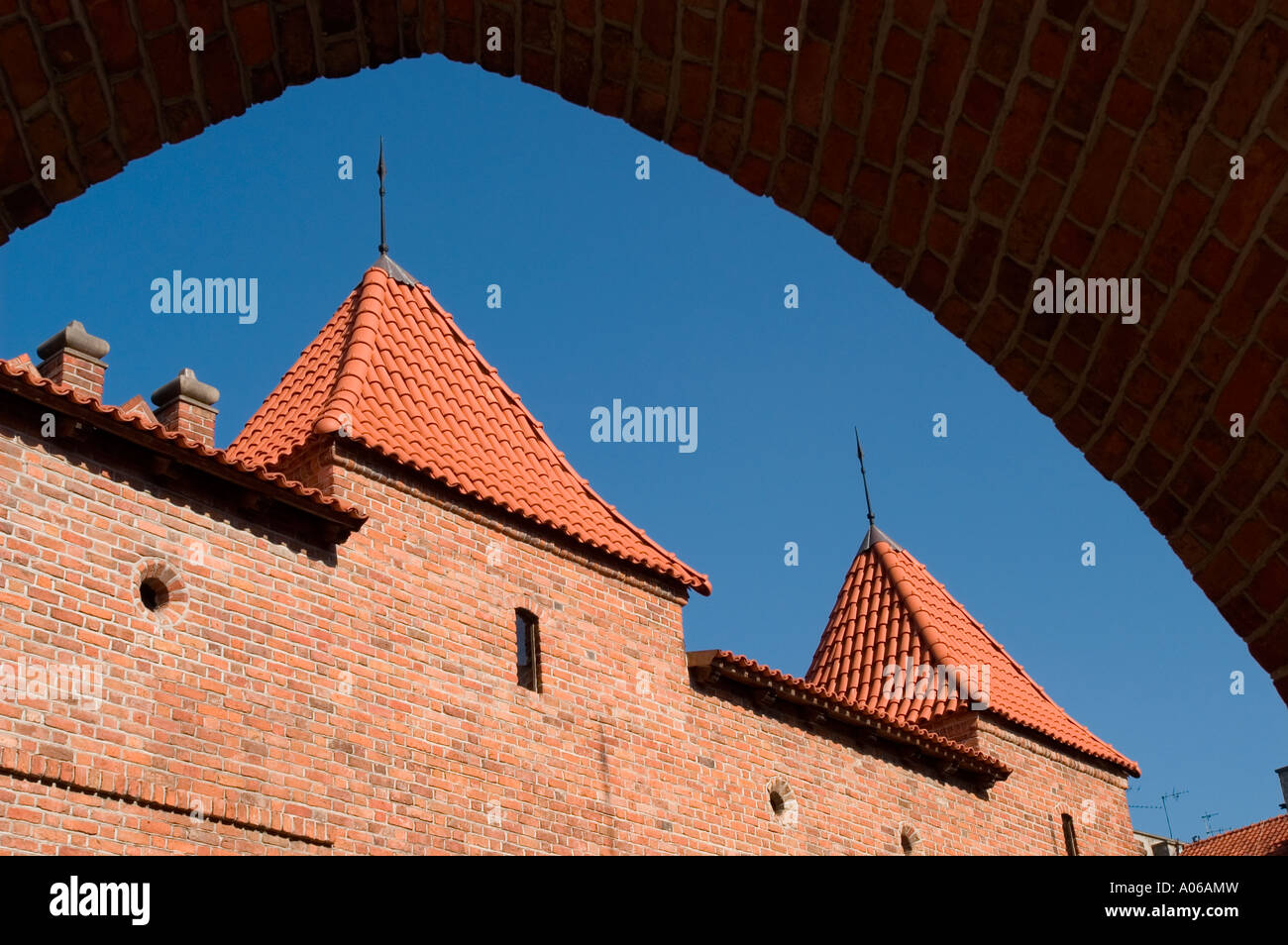 Barbican aka Barbakan medieval defence walls with towers and red tiles ...