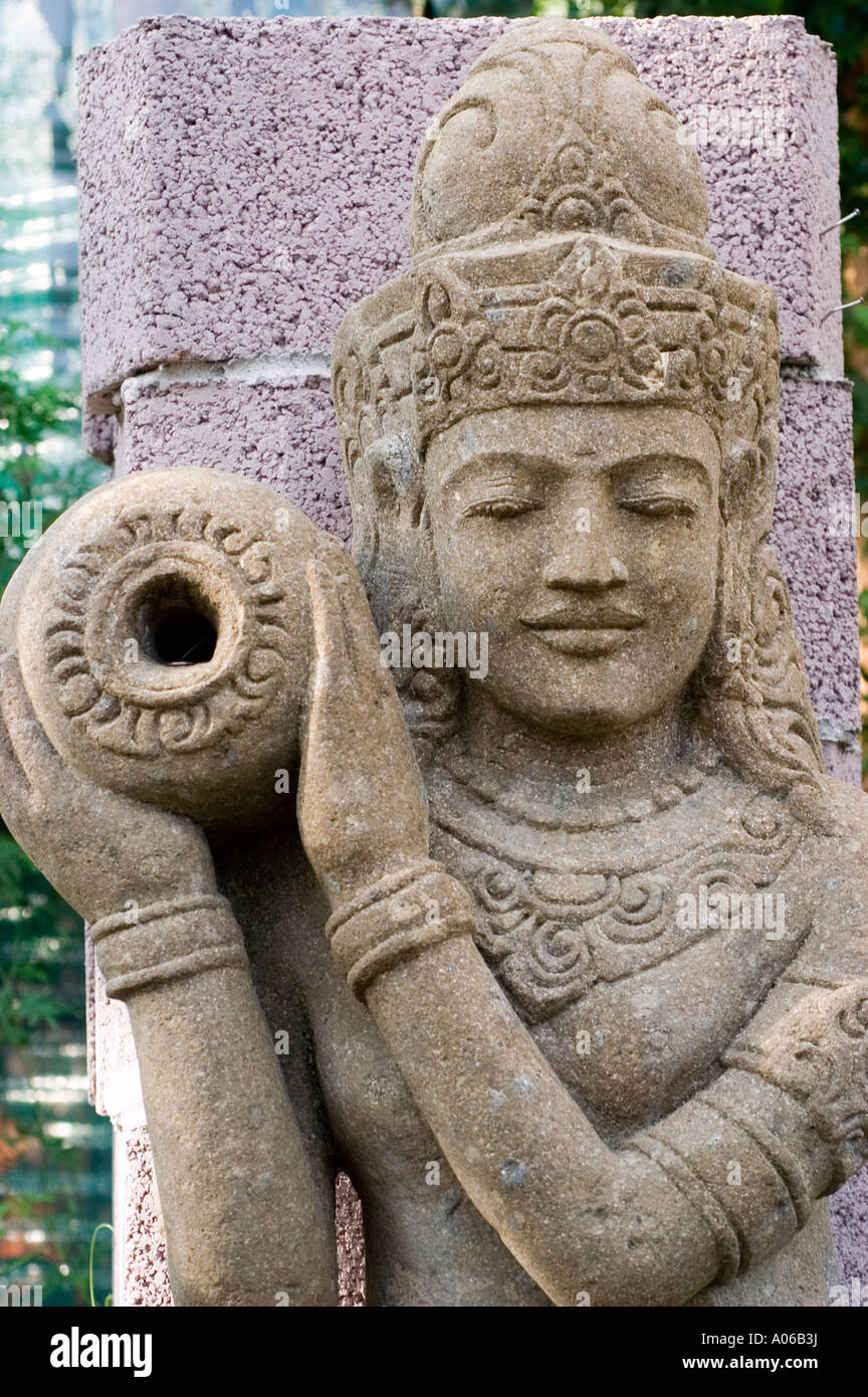 Stone sculpture of female form of Buddhist mother deity Tara with jug ...