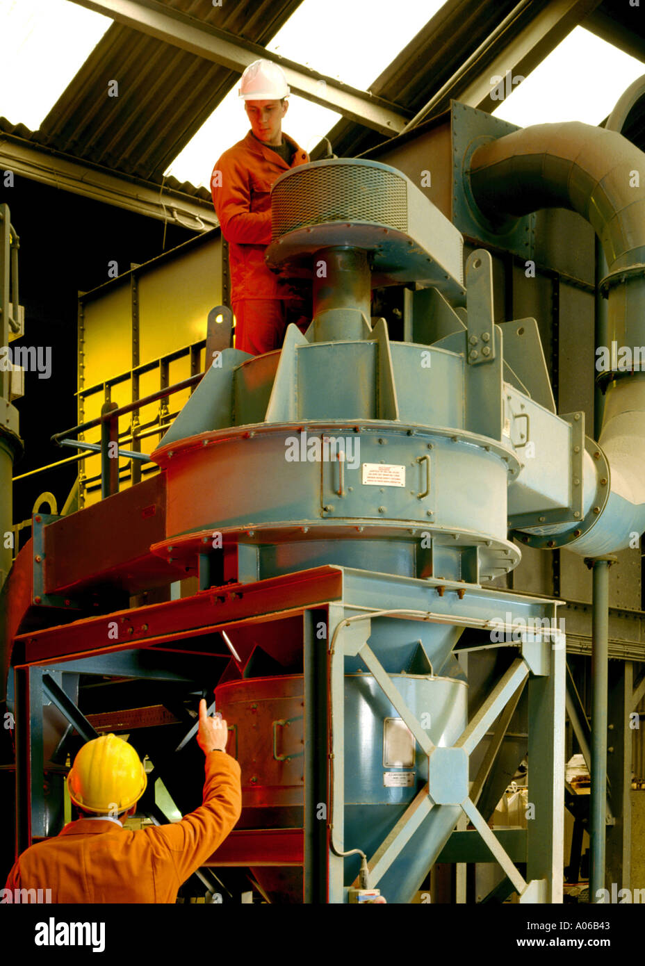 workers in industrial plant with powder hopper Stock Photo - Alamy