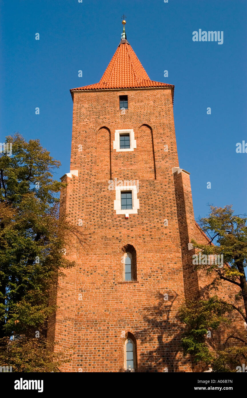 Red brick Holy Cross Church with blue sky background Krakow or Cracow ...