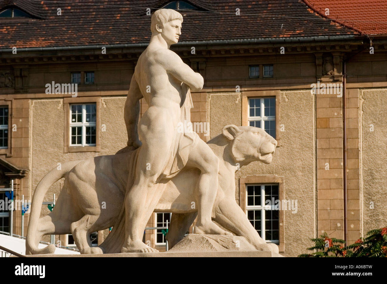 Classical stone sculpture of man and lion decorating Poznan Great ...