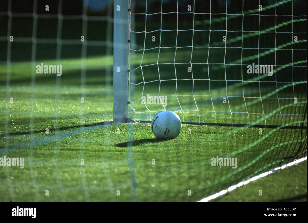 Soccer ball in goal Stock Photo - Alamy