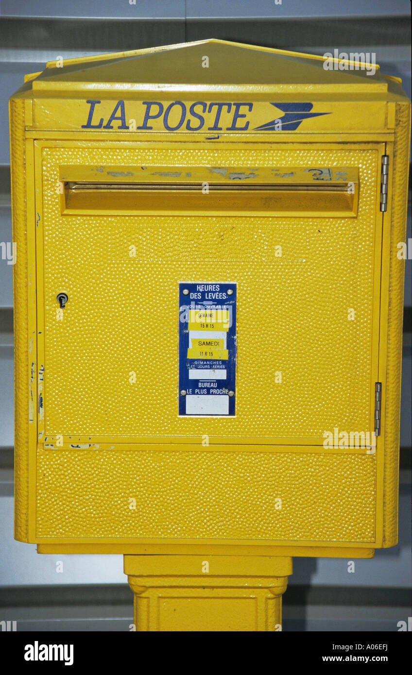 Detail of a bright yellow Post box in Normandy Stock Photo - Alamy