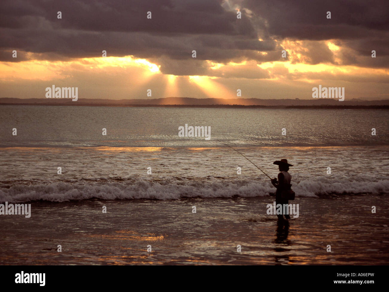 Indonesia Java Pangandaran fisherman fishing on shore at twilight Stock ...
