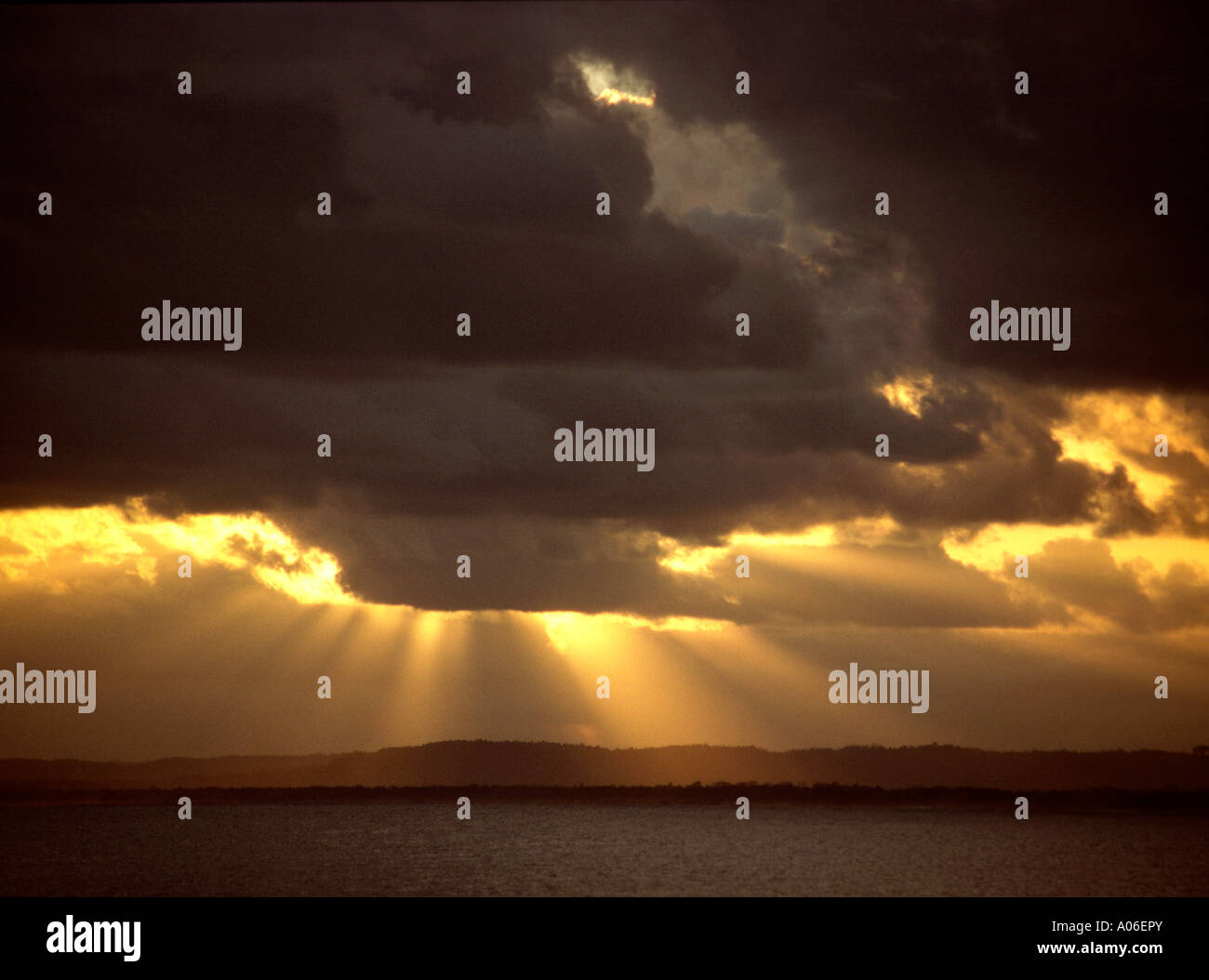 Indonesia Java Pangandaran shafts of light from setting sun Stock Photo ...