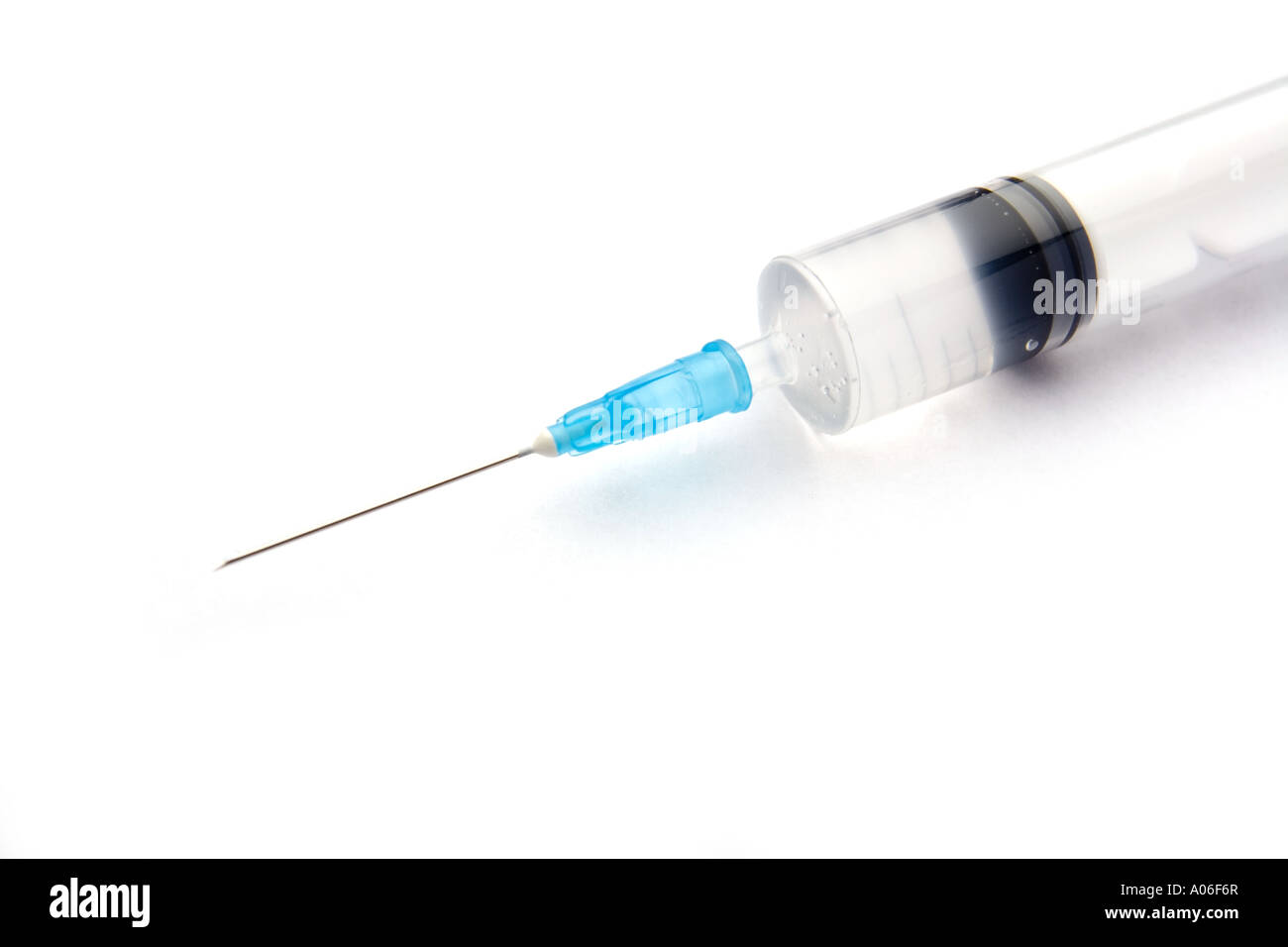 Needle and syringe on a white studio background Stock Photo - Alamy