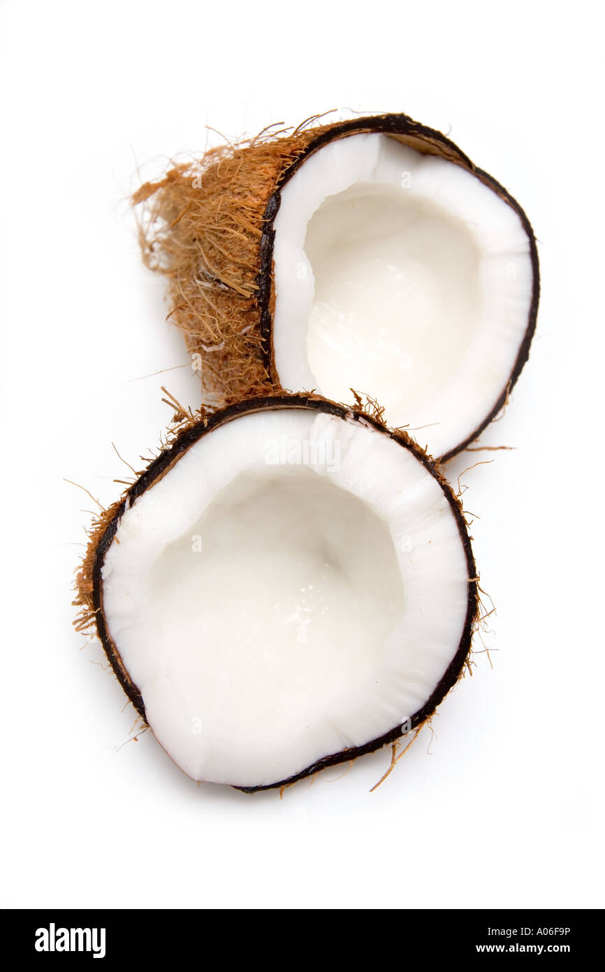 Coconut halved on a white studio background Stock Photo - Alamy