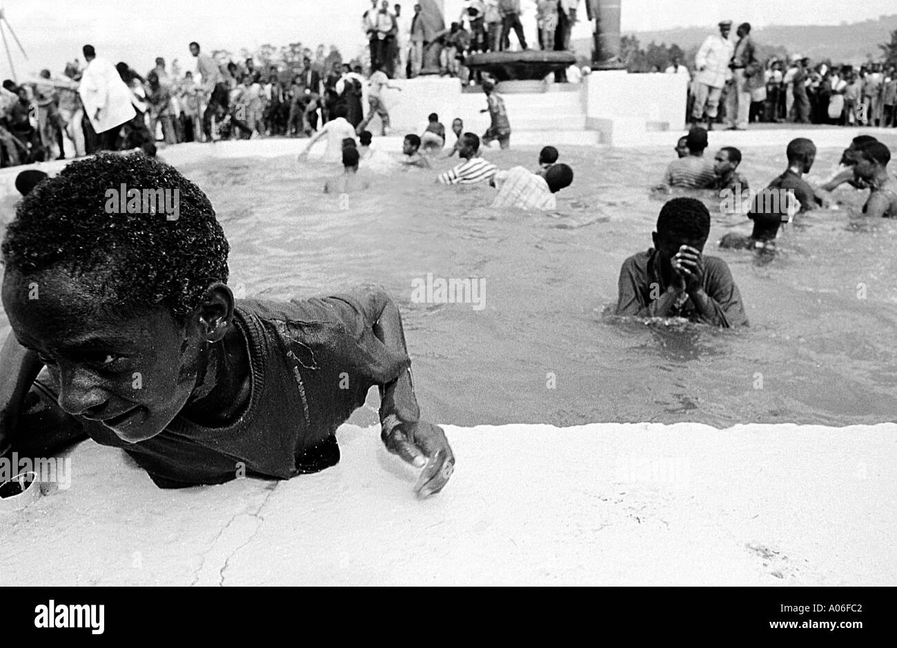 Child swimming in holy water during Timkat religious celebration in ...