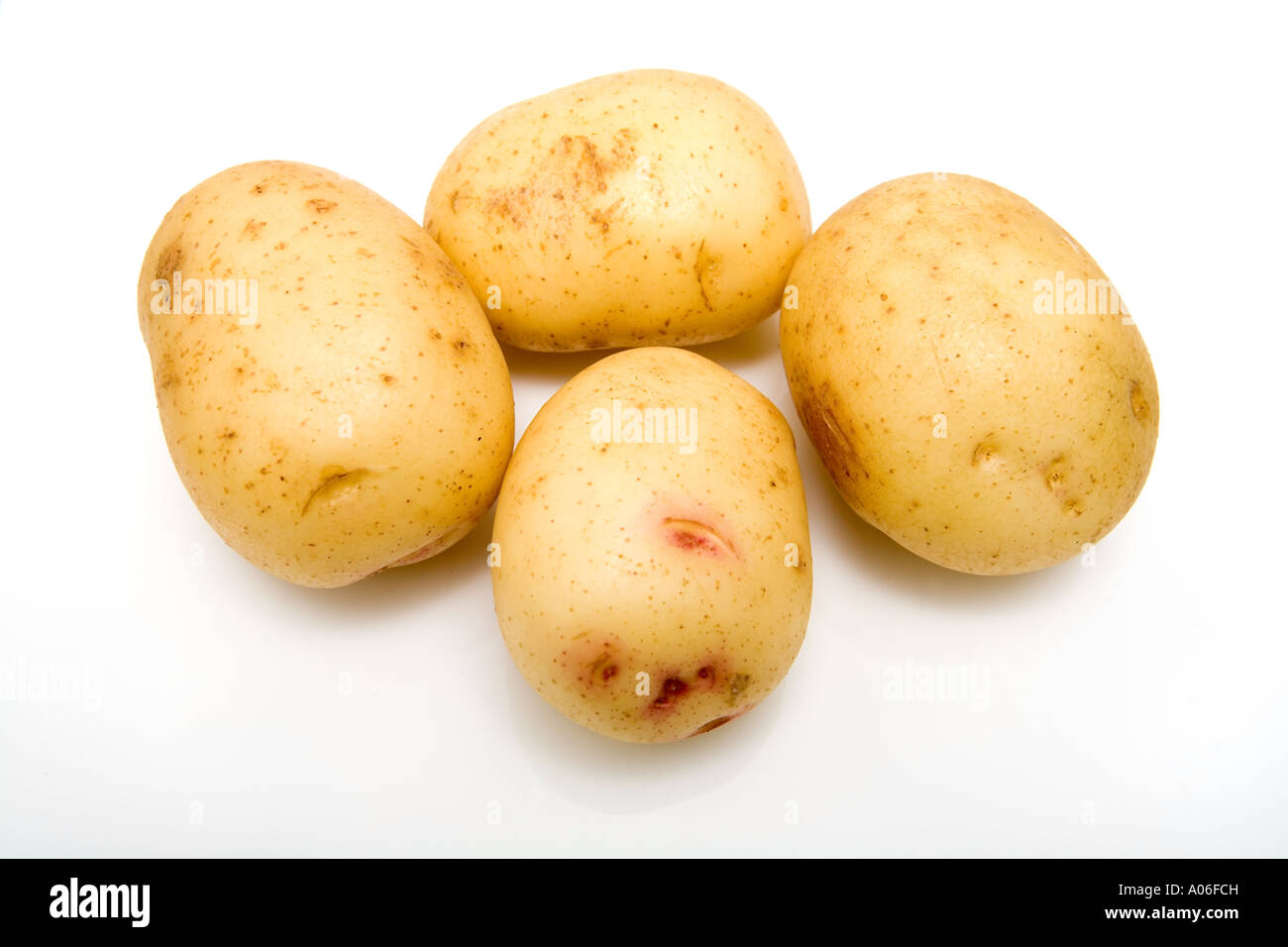 White potatoes isolated on a white studio background Stock Photo - Alamy