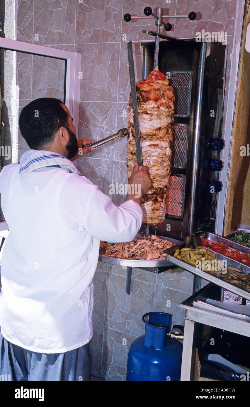 Street vendor carving doner meat in Istanbul Stock Photo - Alamy