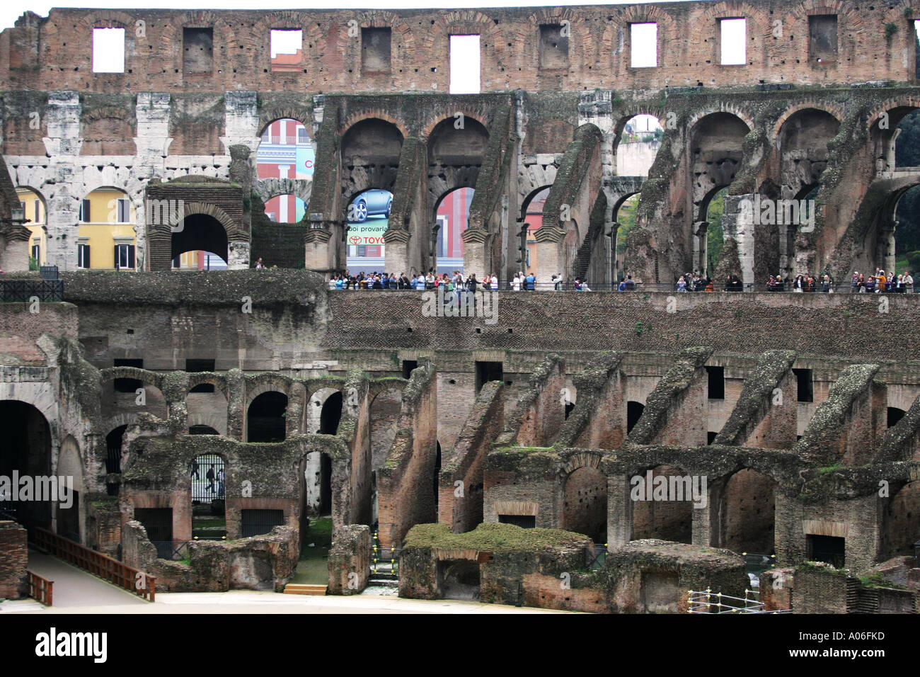 Tourists explore ancient landmark ruins Colosseum with Japanese car ...
