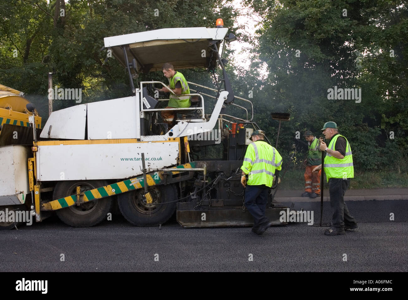 Road workmen machine hi-res stock photography and images - Alamy