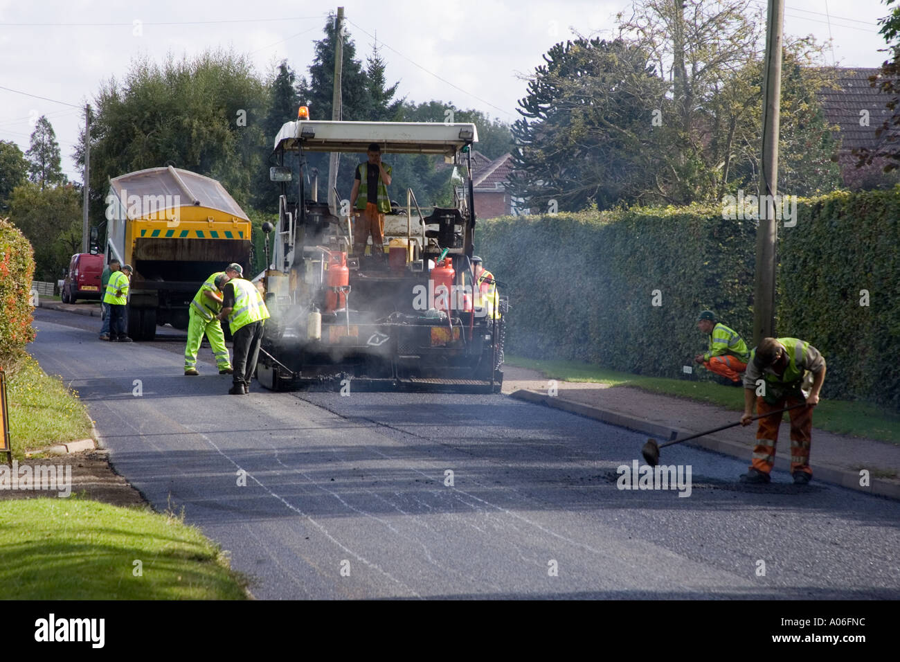 Tarmac asphalt being laid to resurface a road in Suffolk, UK Stock ...
