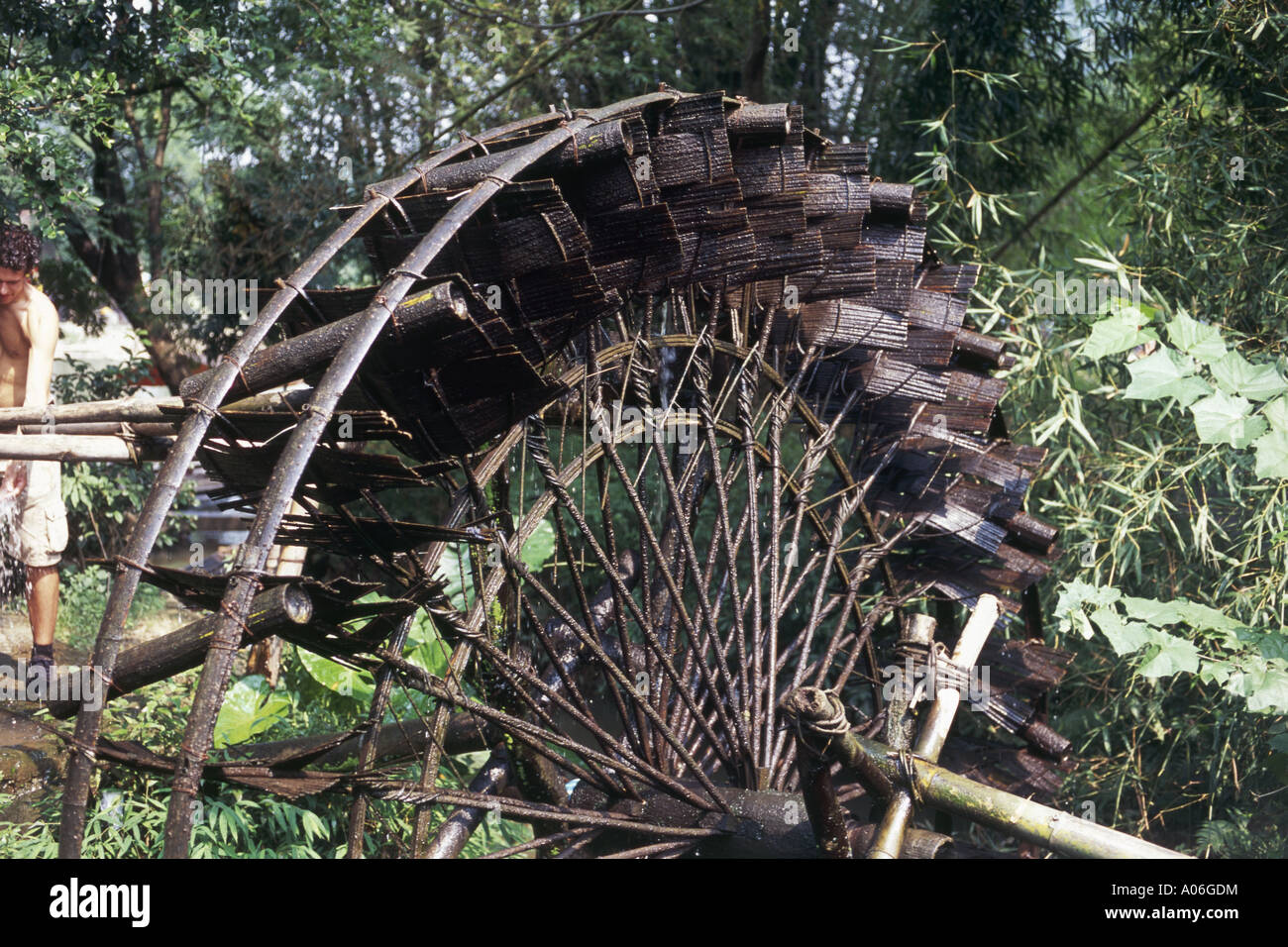 Traditional waterwheel at the banyan tree near Moon Hill in Yangshuo ...
