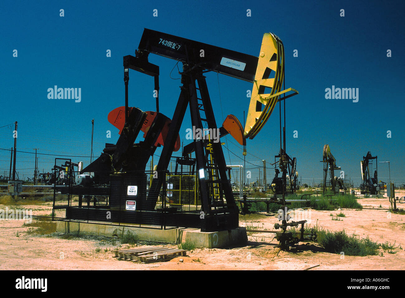 Oil extraction device pumping in a vast field in the San Joaquin Valley ...