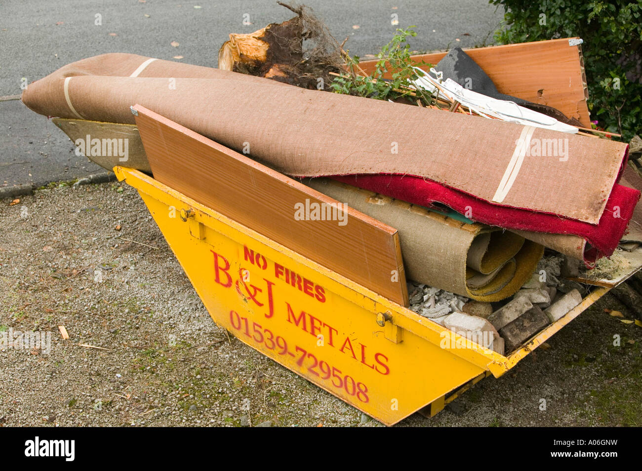 household waste in a skip outside a house being renovated in Ambleside ...