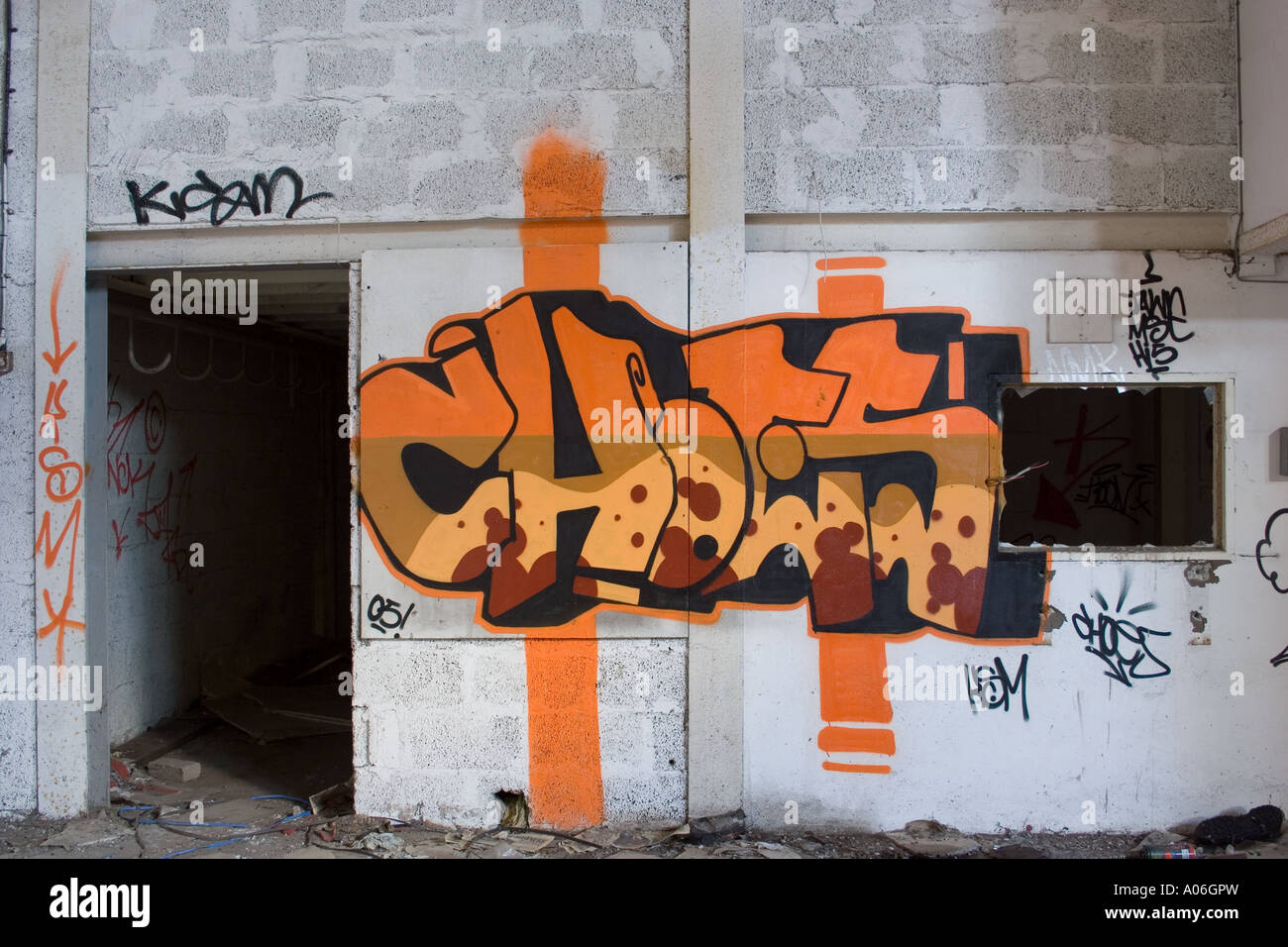 Graffiti murals spray painted all over the walls inside a derelict ...