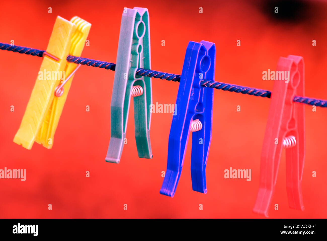 Coloured Pegs hanging on washing line Stock Photo - Alamy