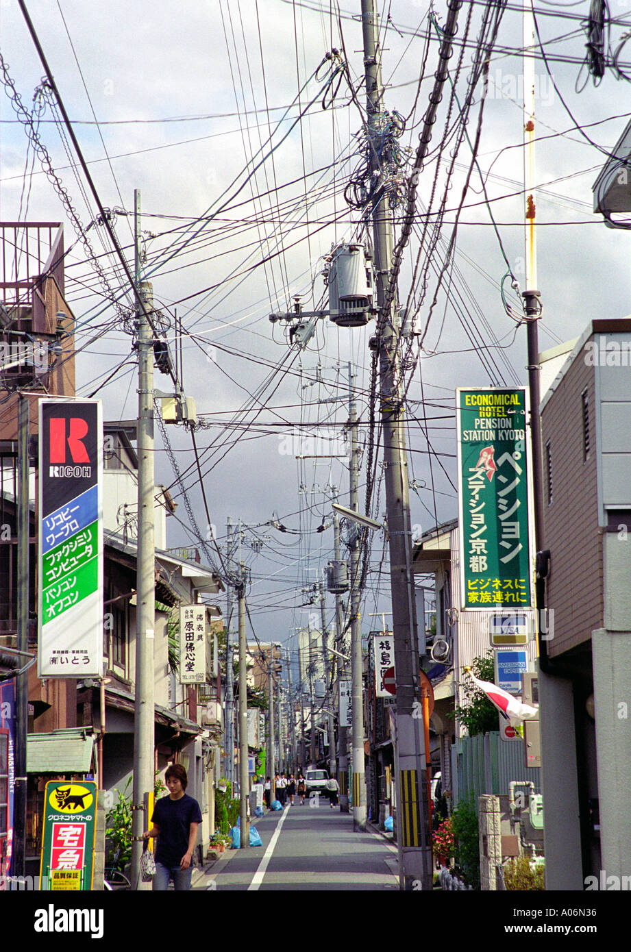 Dense power lines cover a street in Tokyo Japan Stock Photo - Alamy