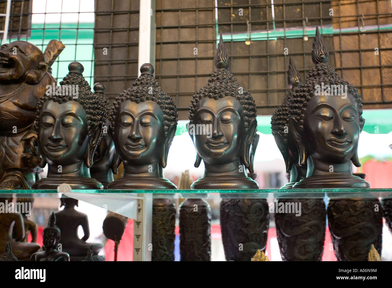 Buddha heads on display at a souvenir market stall Hat Chaweng , Ko ...
