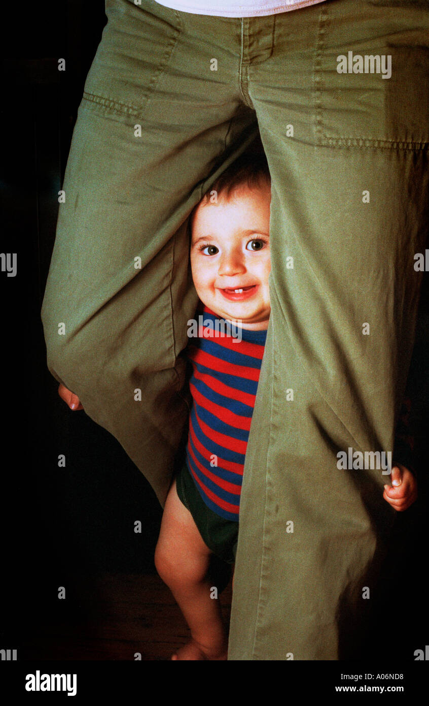A baby looking through the legs of its mother COPYRIGHT GEORGE PHILIPAS ...