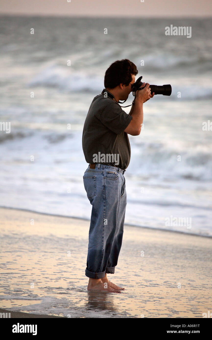 Photographer on a beach in Florida USA Stock Photo - Alamy