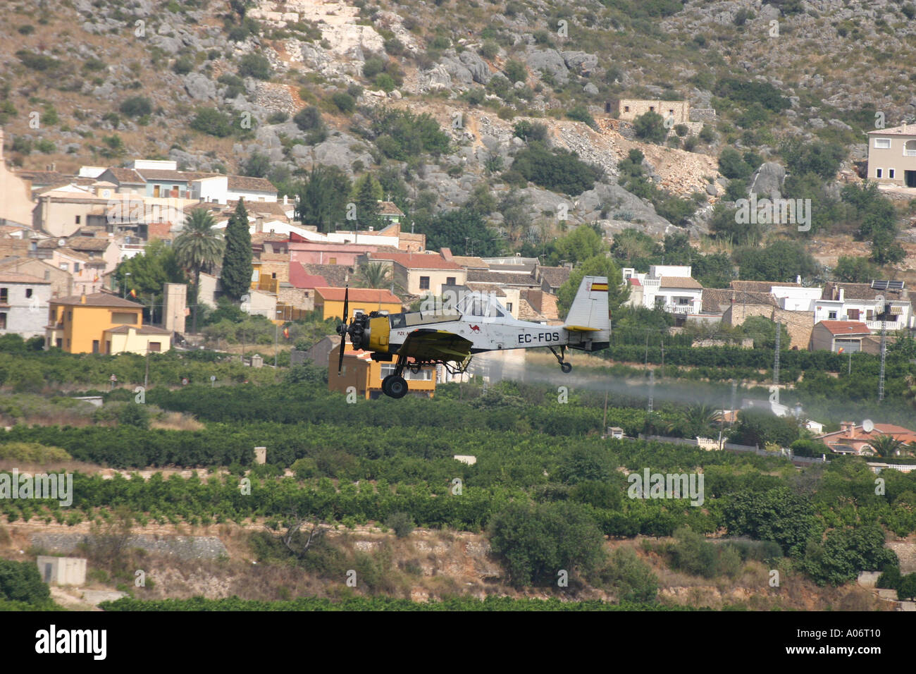 Aerial crop spraying of orange and olive trees groves in the Costa ...