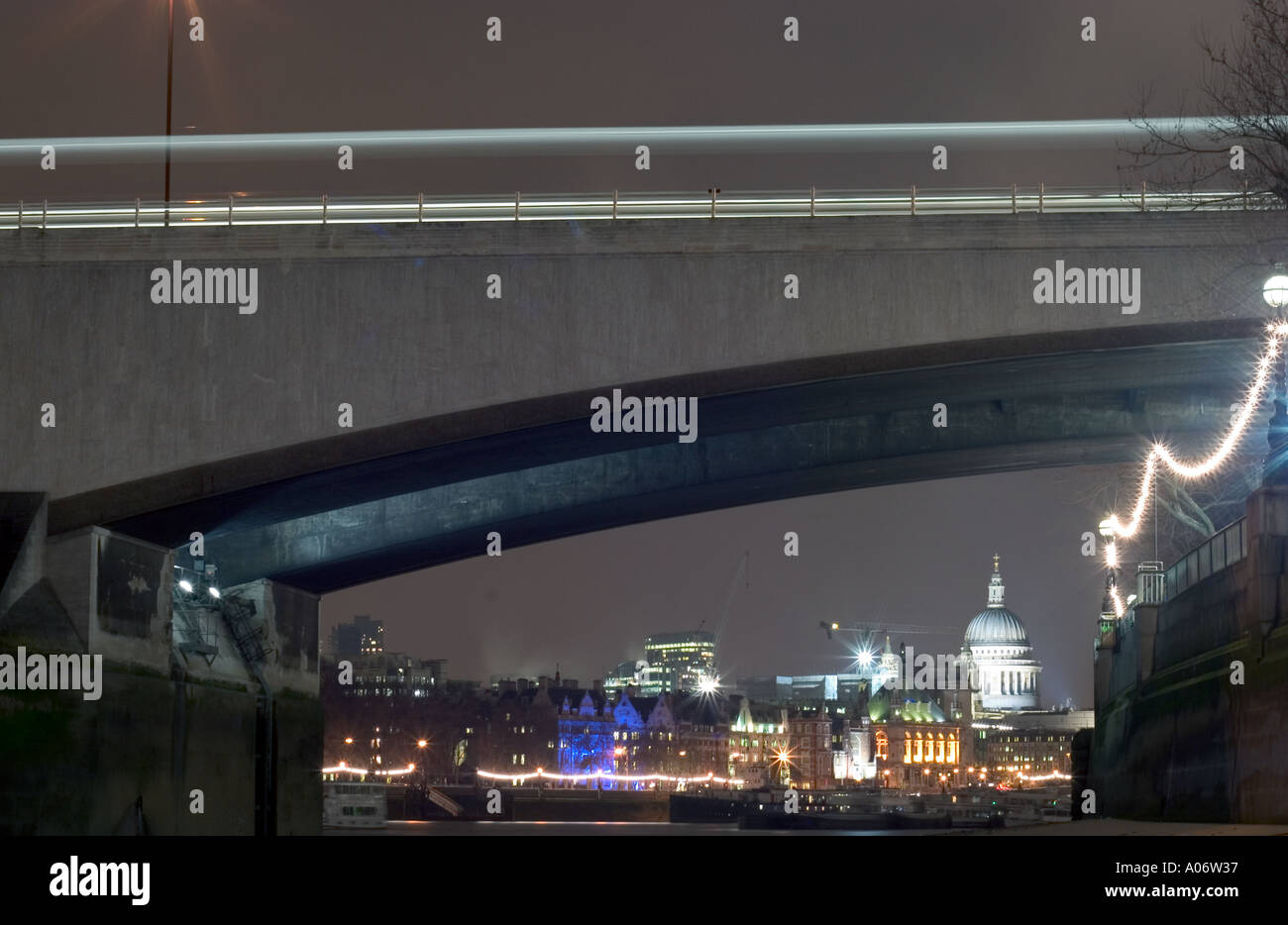Waterloo Bridge at night from Thames foreshore. London, England Stock ...