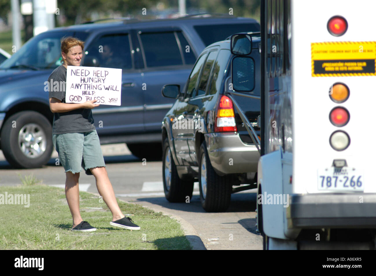 Woman begging on street corner hi-res stock photography and images - Alamy