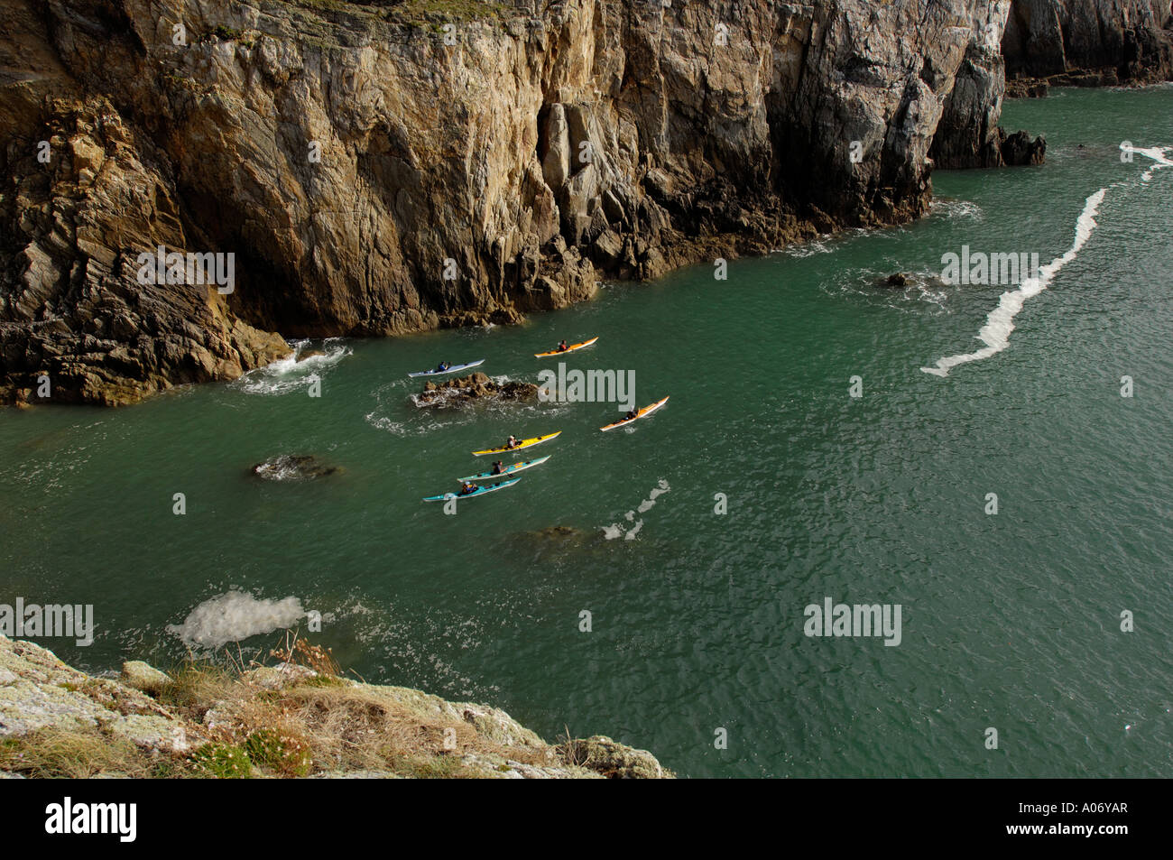 Sea kayaks below cliffs South Stack Holy Island Wales UK Stock Photo ...