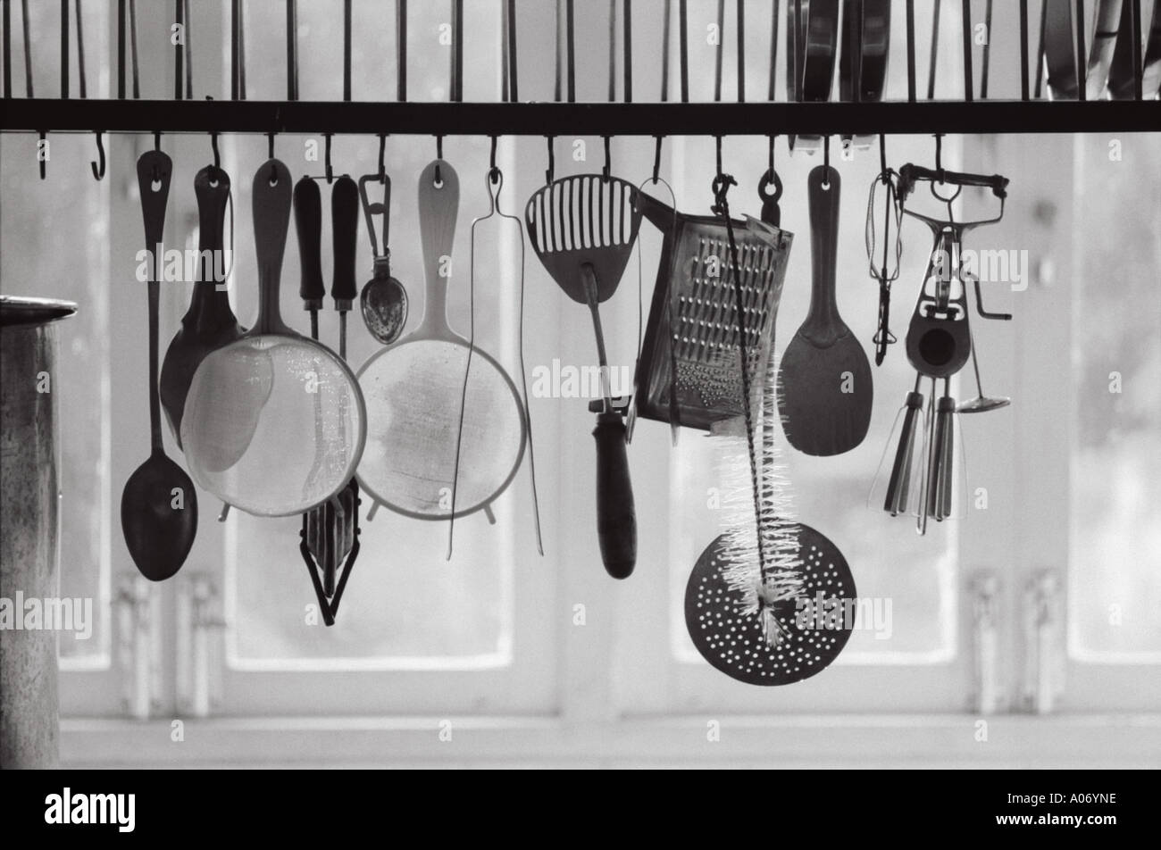 Kitchen utensils hanging Stock Photo - Alamy