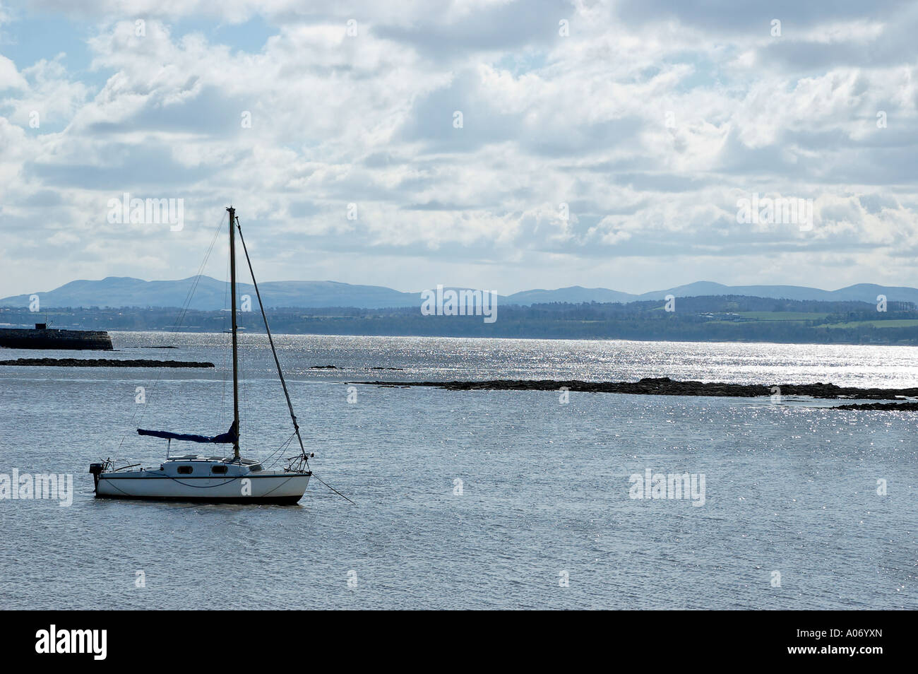 A Landscape Photograph of a Small Yacht in the Firth of Forth at ...