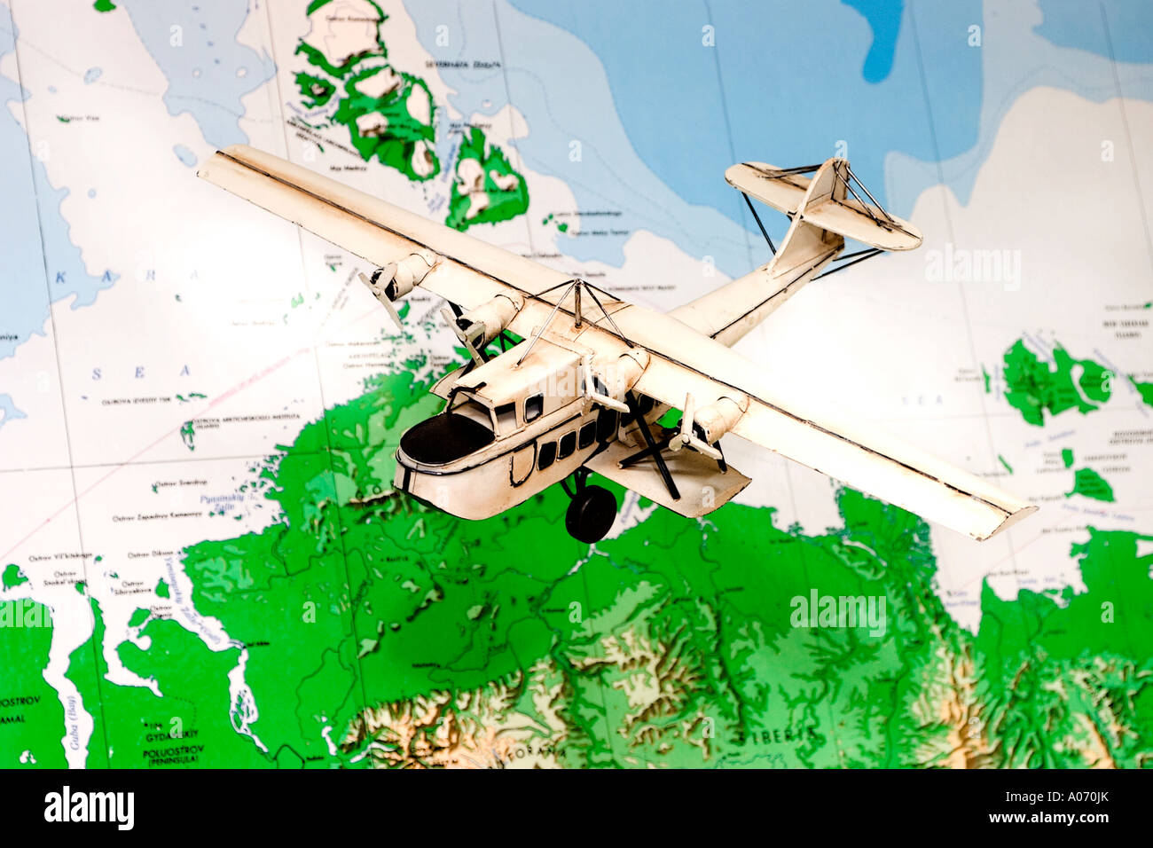 model plane on map of the world Stock Photo - Alamy