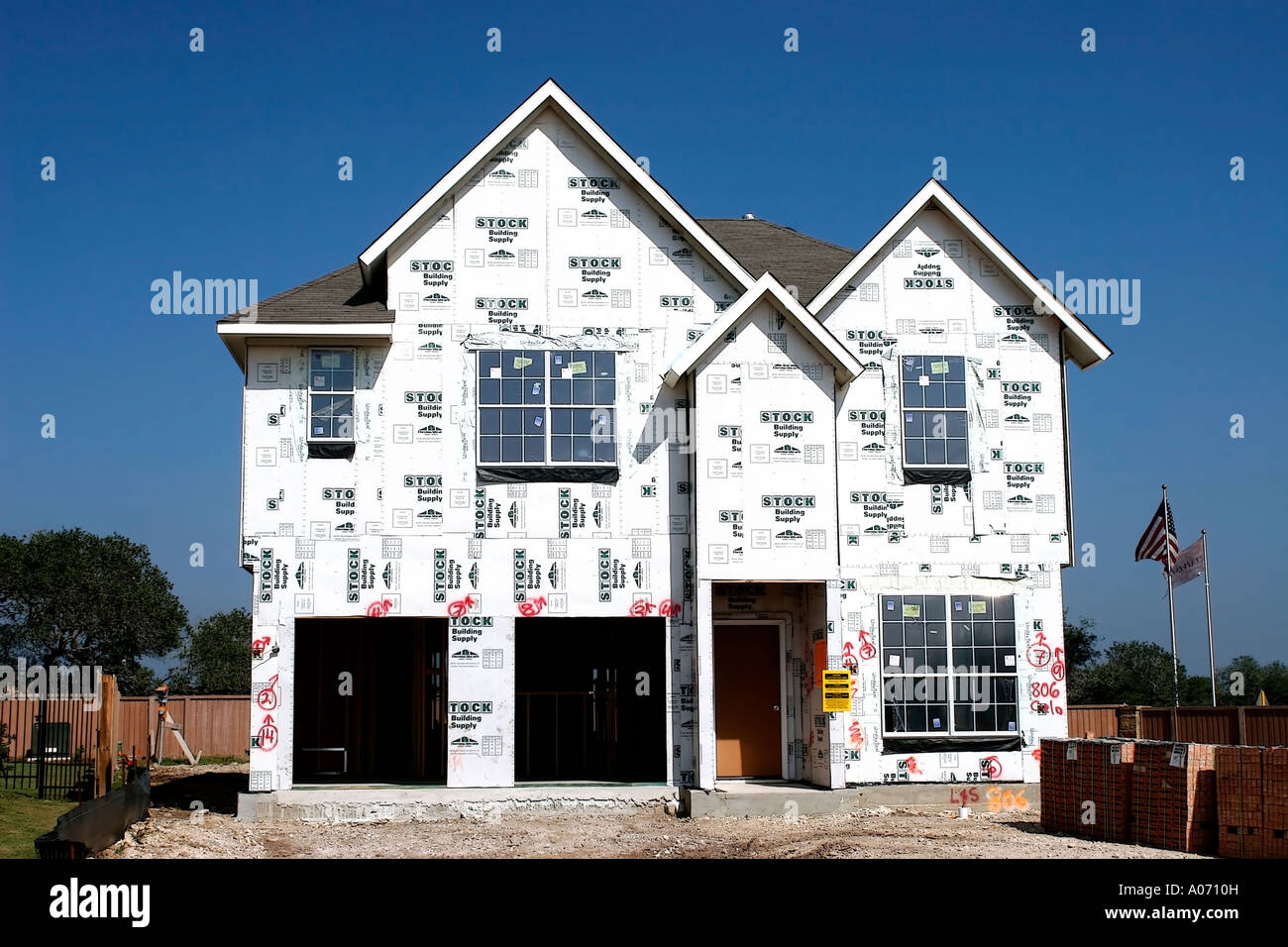 House under construction sheeting hard edges Stock Photo - Alamy