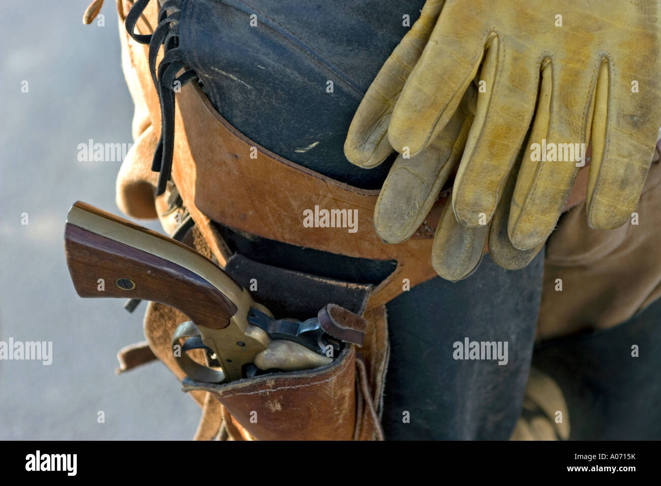 Pistol holster and gloves cowboy western Stock Photo - Alamy