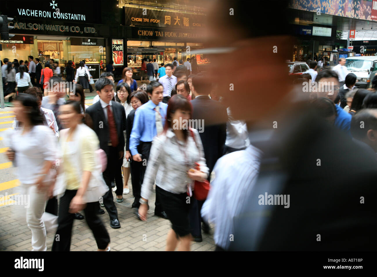 busy and crowded commuter lunchtime streetscene in central business ...